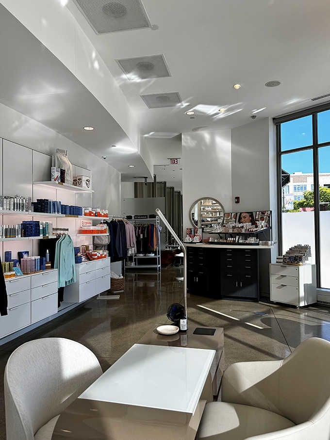 Sunlight streams across polished floors in this bright retail space where wellness products await their new homes.