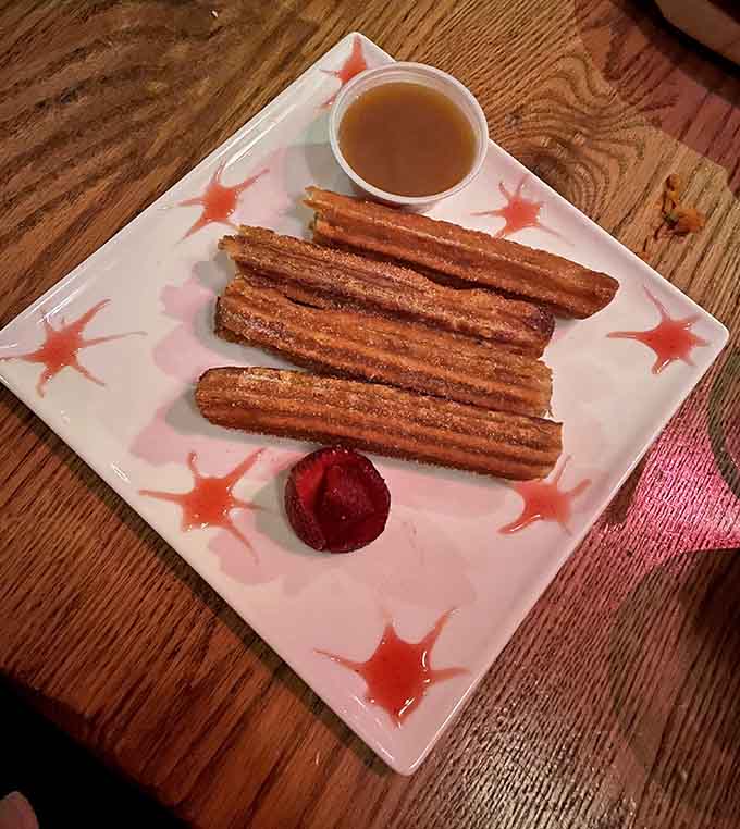 Churros that look like they were made by someone who actually cares about getting the sugar-to-cinnamon ratio right.