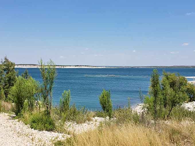 White limestone shores against deep blue water create contrast that seems almost too perfect to be real.