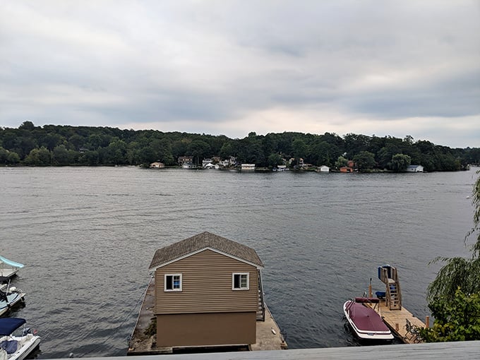 Storm clouds gathering over the lake create drama worthy of a Turner painting, boathouse and all.