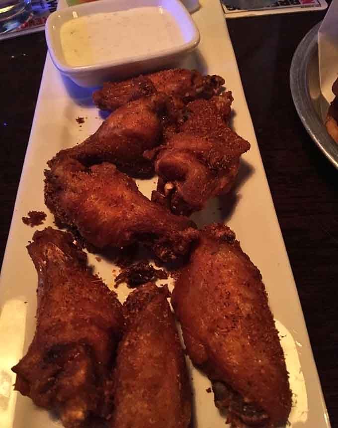 Wings with that perfect golden-brown crisp that makes you hear angels singing, or maybe that's just your stomach growling with anticipation.