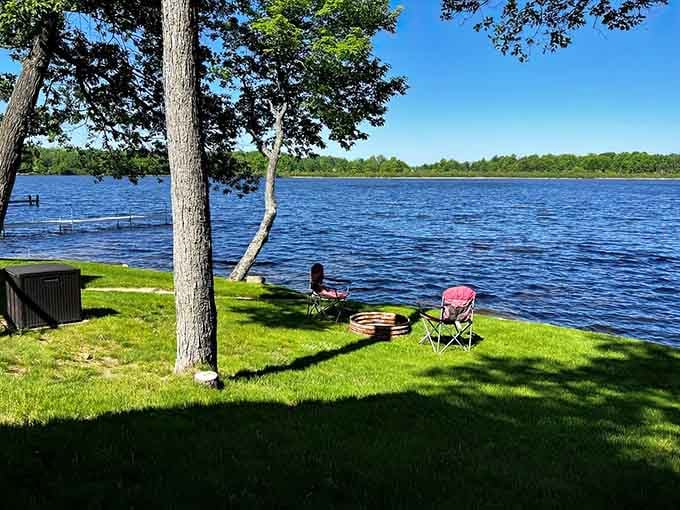 Two lawn chairs, a fire ring, and endless water views: the holy trinity of Michigan lake life perfection.