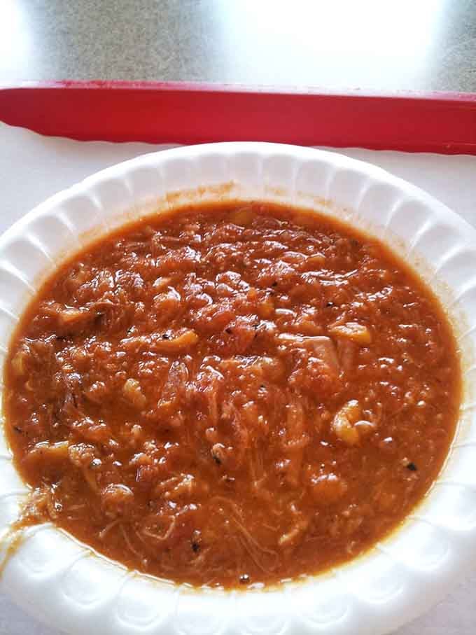 Brunswick stew done right: hearty, tomato-based perfection that separates the amateurs from the professionals in Southern cooking.