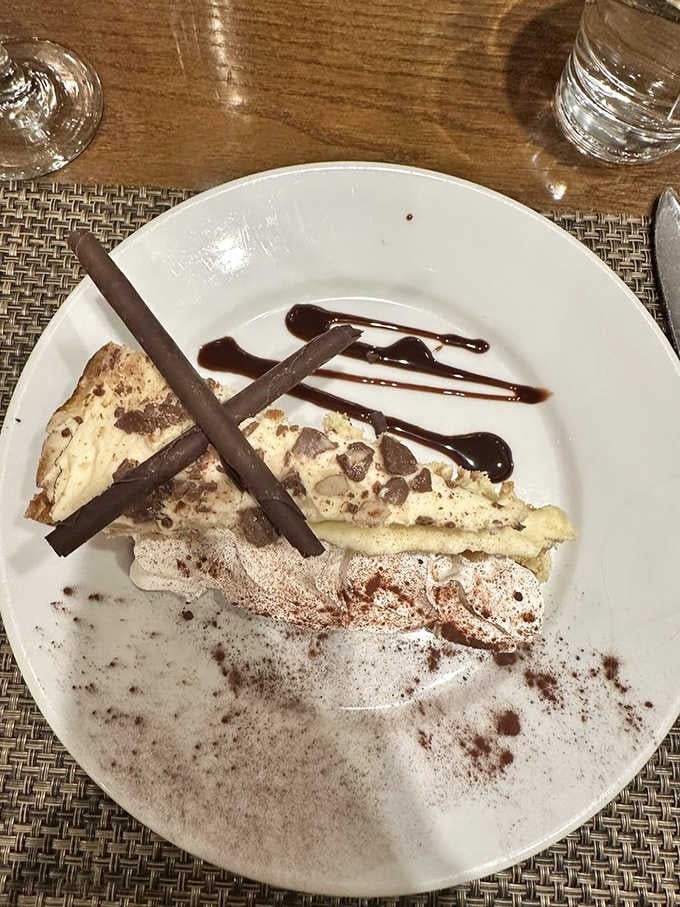 Banana cheesecake with chocolate drizzle and cookie crumbles, because you absolutely deserve dessert after that meal.