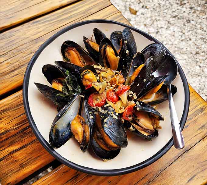 Mussels arranged like edible flower petals, because even shellfish deserve to look this photogenic on your plate.