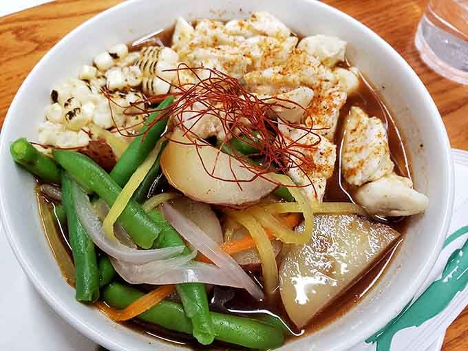 Ramen served with fresh vegetables and perfectly cooked protein shows this cafe's range extends beyond traditional breakfast fare.