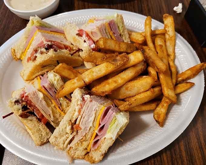 That club sandwich is stacked higher than Barney's opinion of himself and twice as satisfying to enjoy.