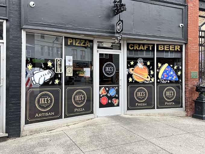 Artisan pizza meets craft beer behind playful windows decorated with planets, proving small towns can be surprisingly sophisticated.
