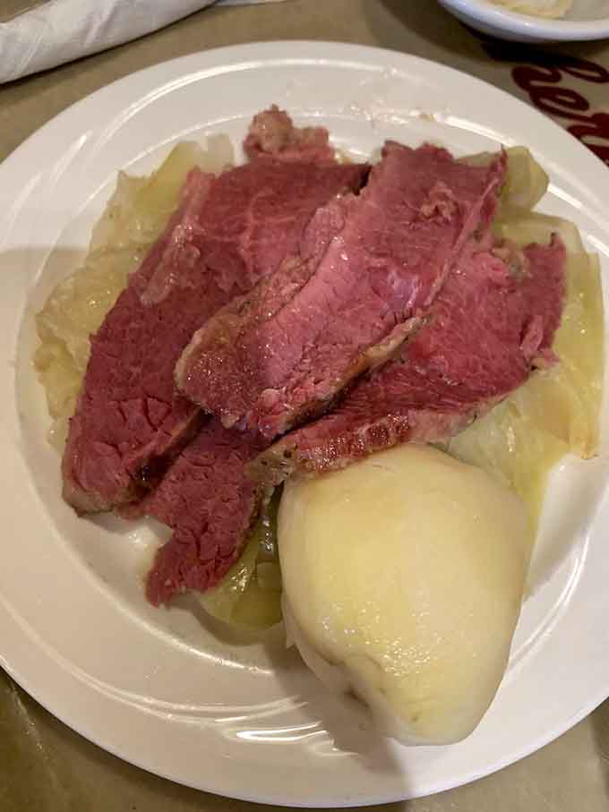 Corned beef and cabbage served over potatoes is the kind of meal that sticks to your ribs lovingly.