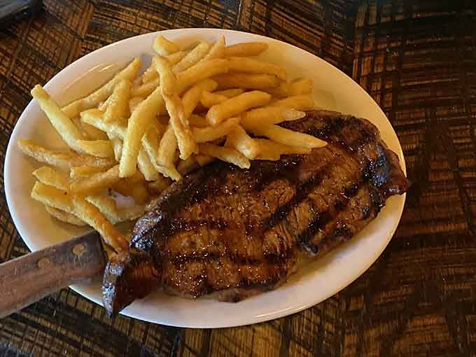 A ribeye with those gorgeous grill marks paired with golden fries proves simplicity done right always wins.