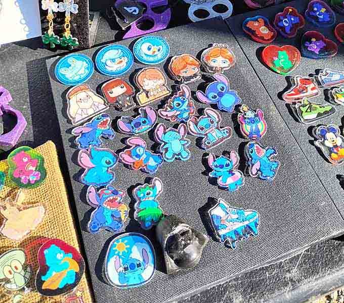Colorful enamel pins featuring everyone's favorite blue alien prove that nostalgia comes in all shapes and sizes here.