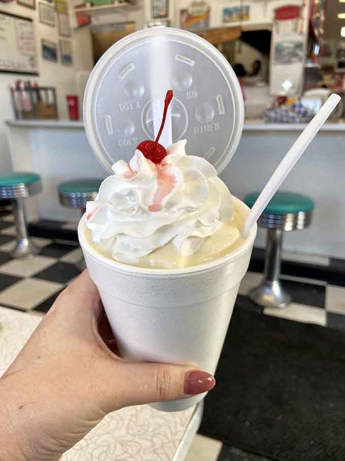 This banana shake comes topped with enough whipped cream to make your cardiologist schedule a friendly chat.