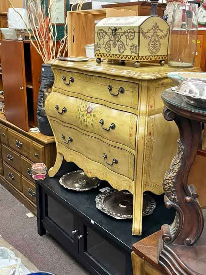 That yellow bomb&eacute; chest with hand-painted florals is giving serious French countryside vibes, and we're here for it.