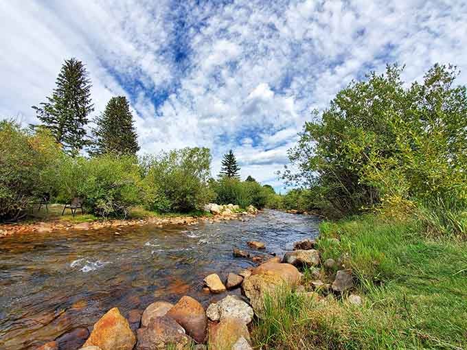 Boulder Creek tumbles over rocks beneath cottonwoods, proving that paradise sometimes comes with a babbling brook soundtrack.