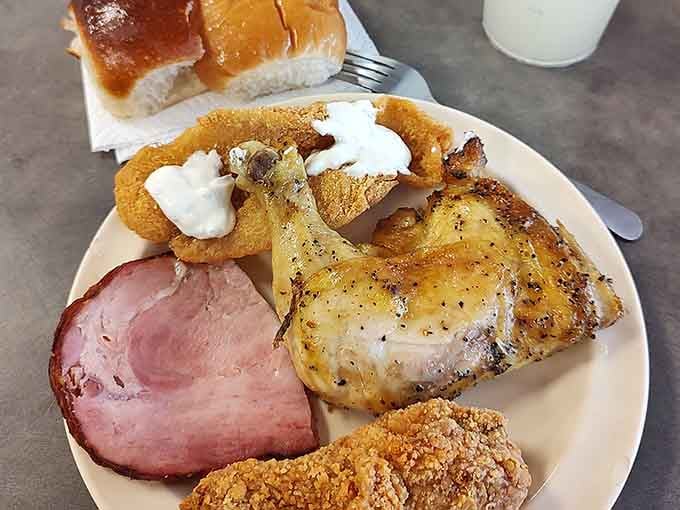 Ham, chicken, onion rings, and rolls create a plate that's basically a Southern greatest hits album in food form.