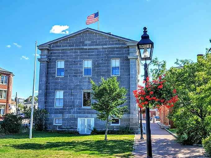 The Custom House stands dignified in granite, flying the flag and guarding maritime history like it has for generations past.