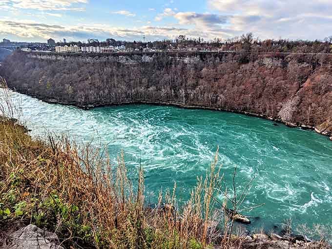 Whirlpool State Park showcases the Niagara River's swirling turquoise waters carving through ancient rock formations spectacularly.