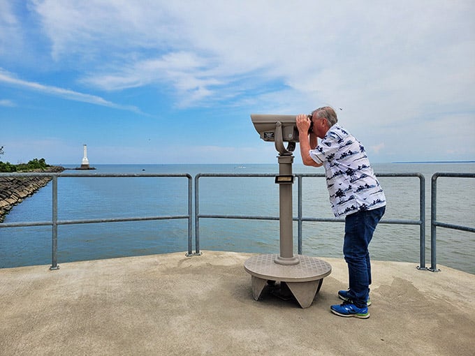 Scanning the horizon for ships, Canada, or just pretending you're a lighthouse keeper from a simpler time.