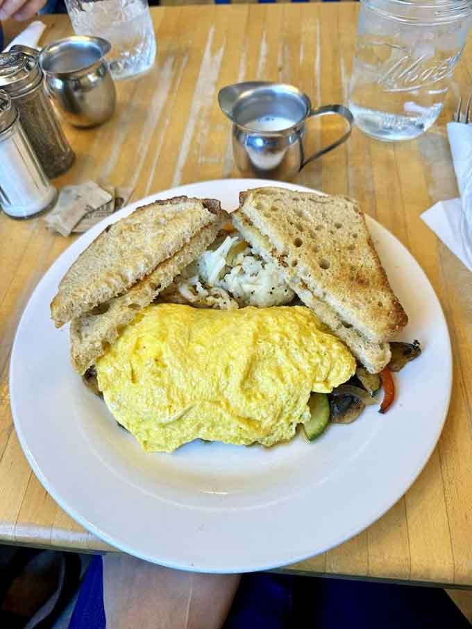 When your omelet comes with perfectly crispy hash browns and toast, you know someone in that kitchen truly understands breakfast priorities.