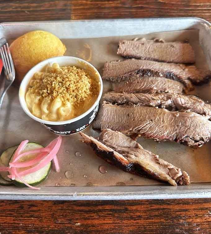 Brisket sliced thick with mac and cheese backup: this is what retirement planning should really look like.
