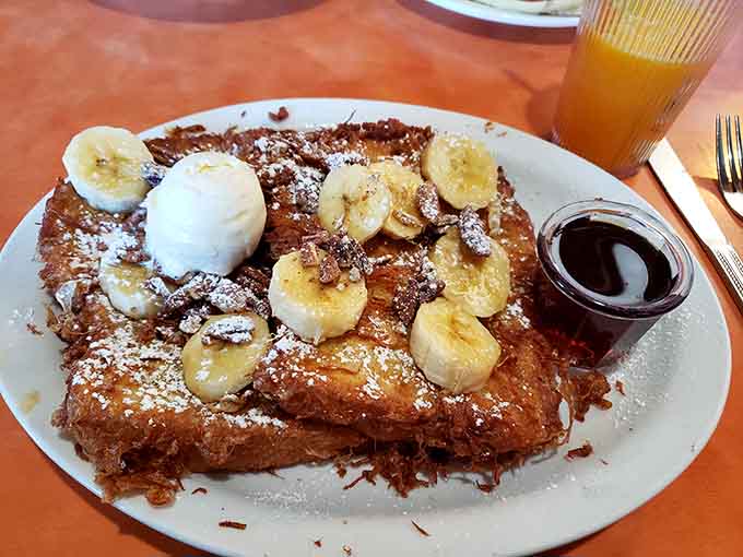 French toast topped with bananas and powdered sugar&mdash;this is what breakfast dreams look like when they come true.