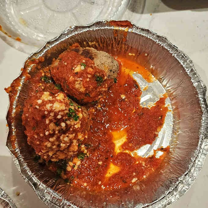 Meatballs swimming in sauce, ready to make your Italian food dreams come gloriously true.