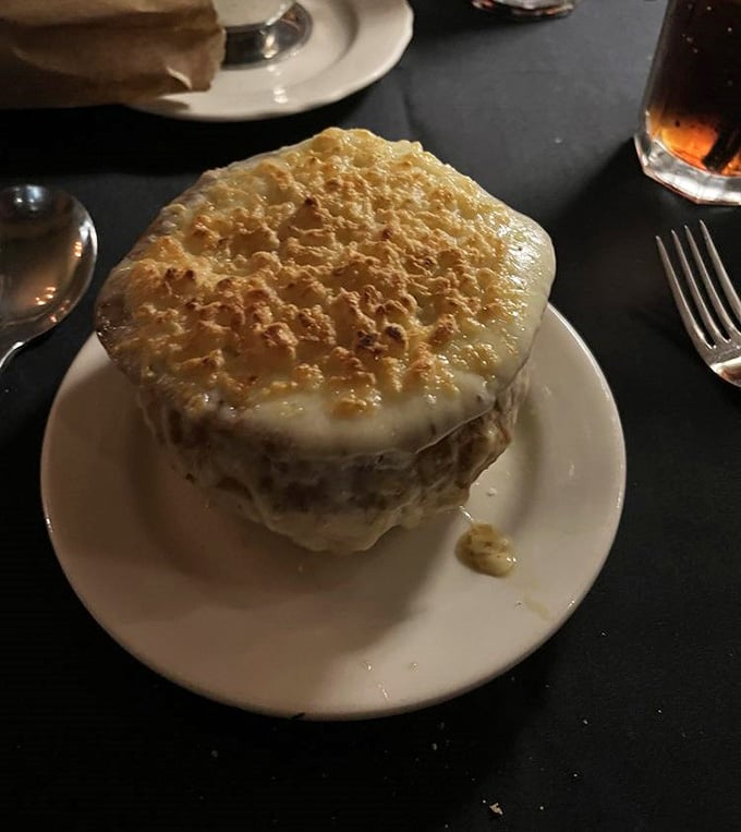 French onion soup with a cheese crown so tall it deserves its own zip code.