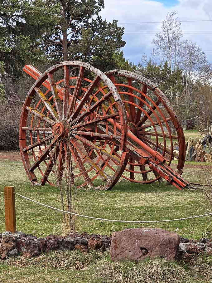 These massive vintage wheels add a touch of agricultural nostalgia to an already wonderfully eclectic outdoor museum experience.