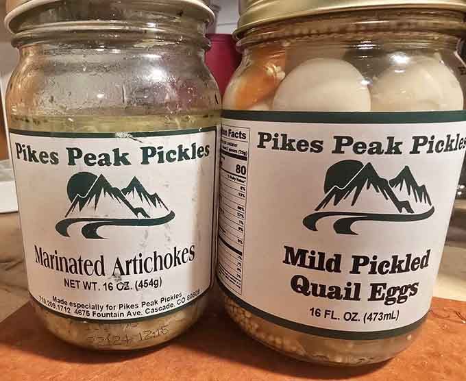 Marinated artichokes and pickled quail eggs sit side by side, proving adventure comes in many briny forms.