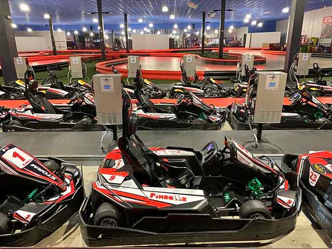 Go-karts line up like eager racehorses, waiting to unleash your inner speed demon safely.