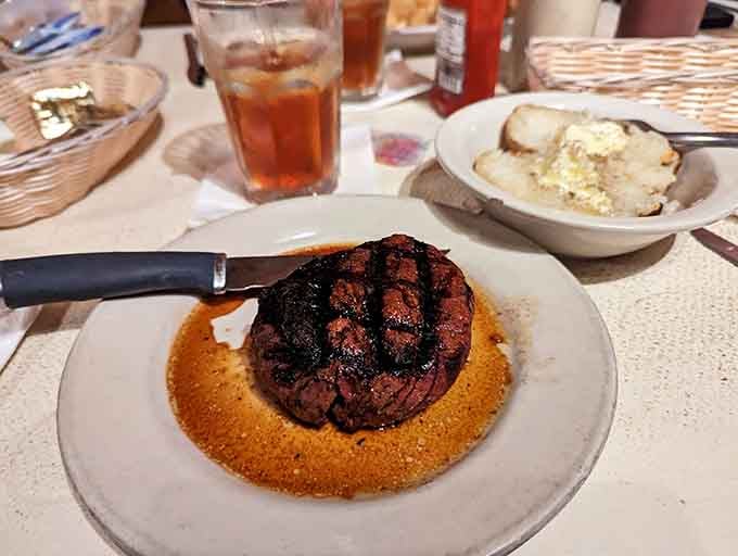 The filet mignon arrives looking like it just won best in show at the beef Olympics.