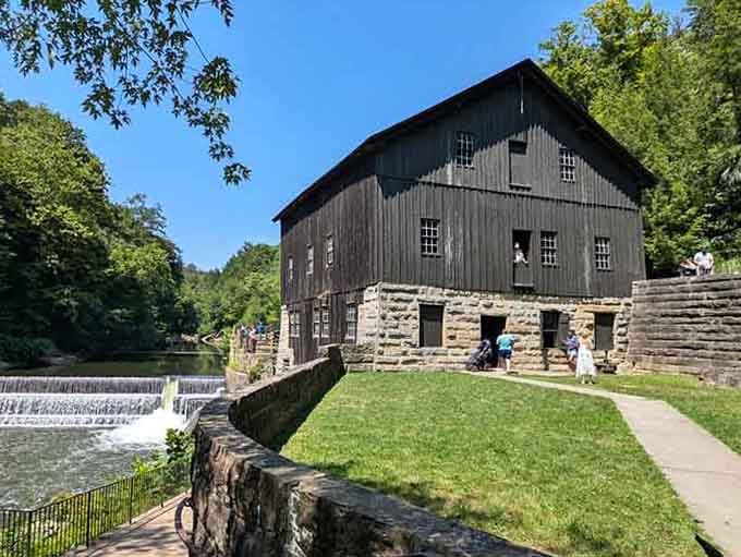 Stone foundation meeting weathered wood, this mill has seen more seasons than most of us have seen birthdays.