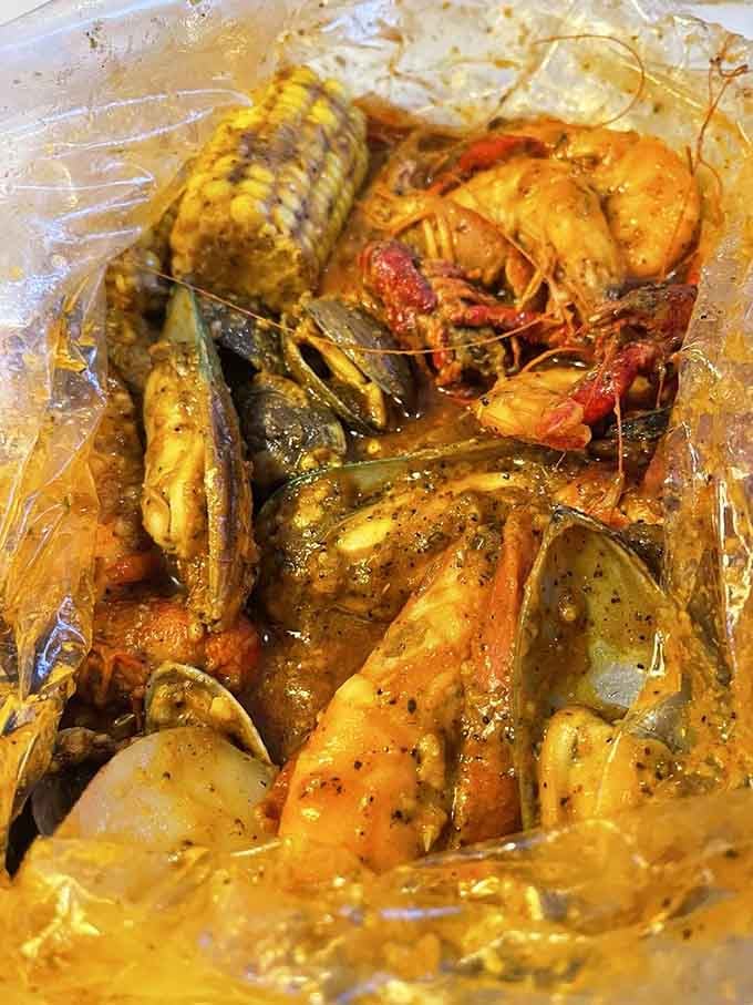 This glorious seafood boil bag is what happens when the ocean decides to throw you a party you'll never forget.