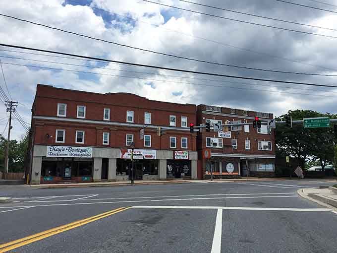 Historic storefronts housing real businesses run by actual neighbors, not corporate overlords from distant cities.