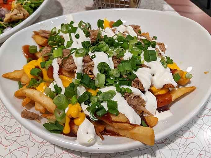 Loaded fries topped with all the good stuff, because sometimes restraint is overrated and delicious is everything.