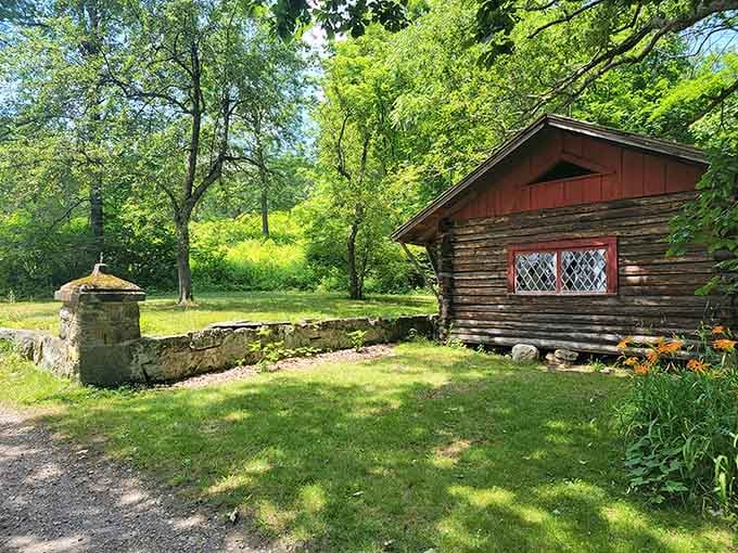 That rustic cabin reflected in still water creates a scene straight from a postcard nobody believes is real.