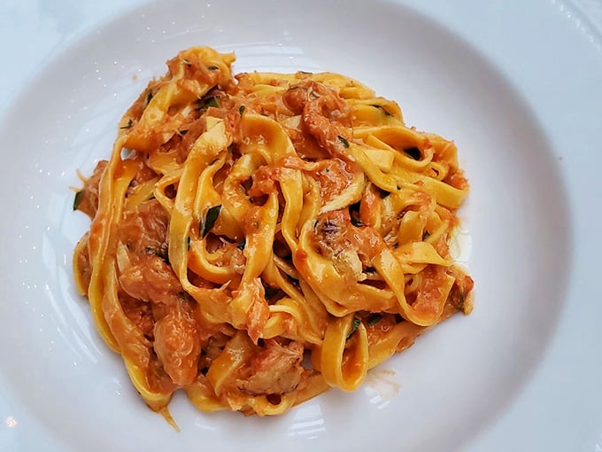 Fresh tagliolini catching every bit of that spider crab sauce, this is what pasta dreams are made of.