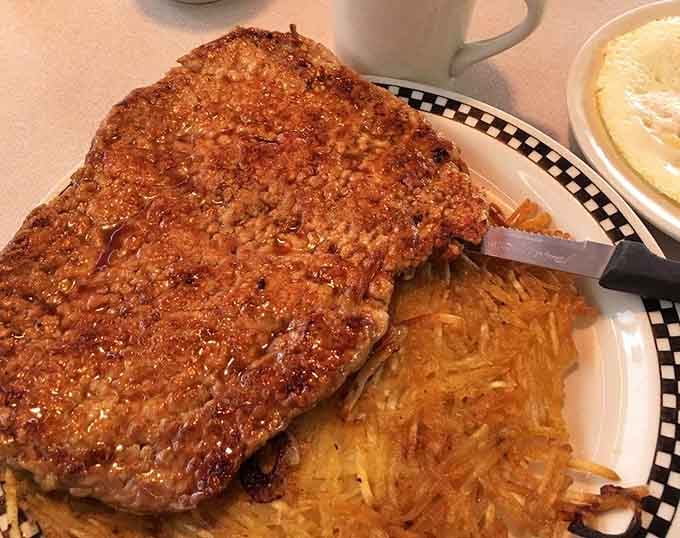 The pork tenderloin is so massive it makes the plate look like it's auditioning for a smaller role.