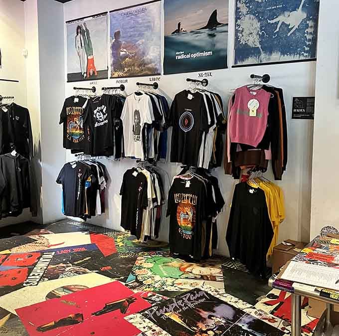 Band tees displayed like art because let's face it, that vintage Led Zeppelin shirt is basically wearable culture.