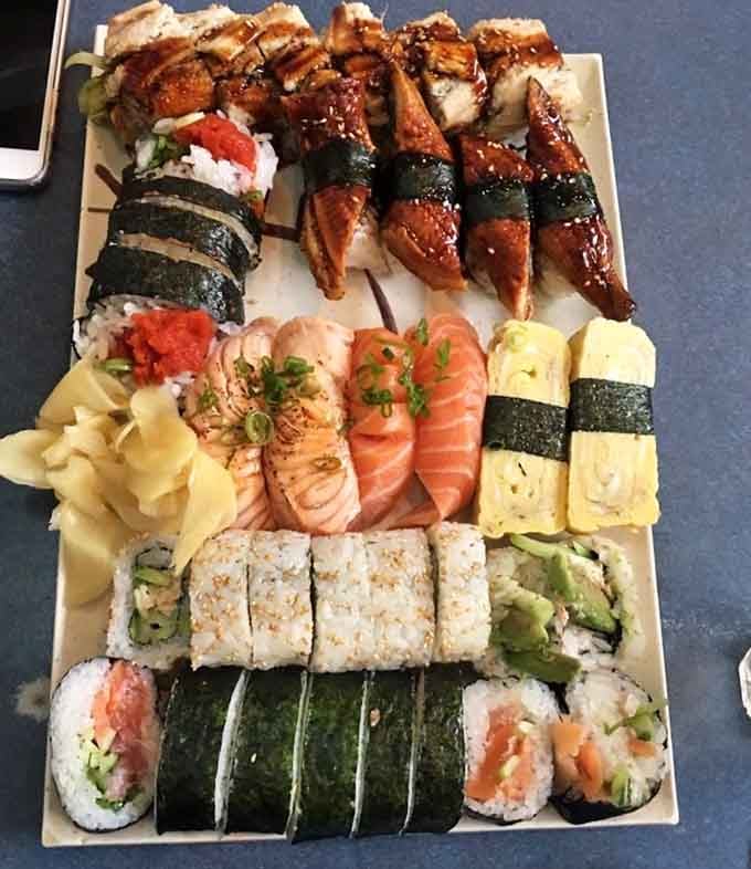 A sushi platter so beautifully abundant it deserves its own zip code and possibly a forklift for transport.