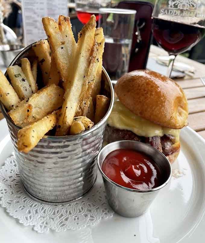 That burger and those perfectly seasoned fries understand the assignment: comfort food that pairs beautifully with Cabernet.
