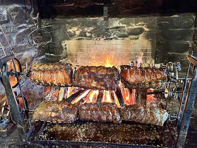 Watching meat roast over an open hearth like it's 1776 never gets old, especially when you're eating it.