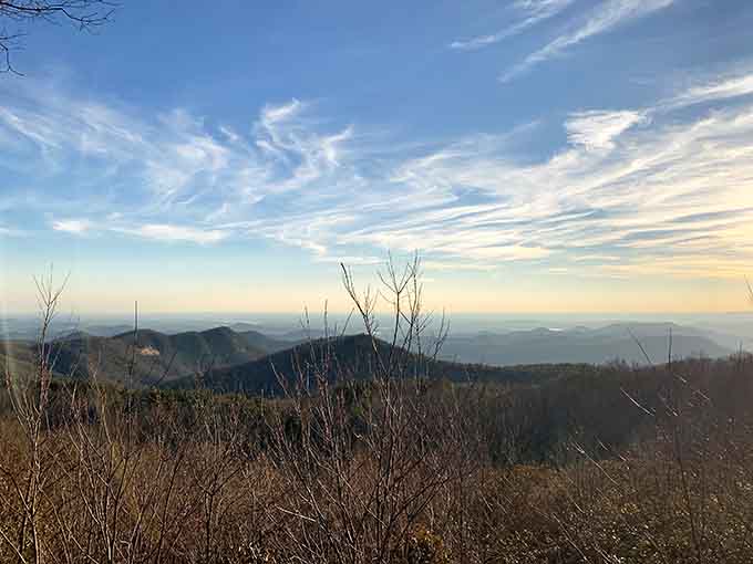 Morning mist settles between the ridges like nature's own special effects department went wild.