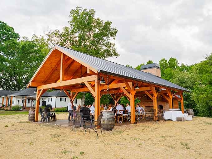 The timber pavilion stands ready to host everything from weddings to workshops, all framed by nature's finest decorations.