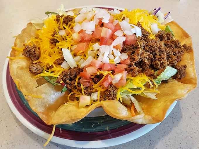 A taco salad bowl piled high with seasoned beef and fresh toppings, because lunch deserves love too.