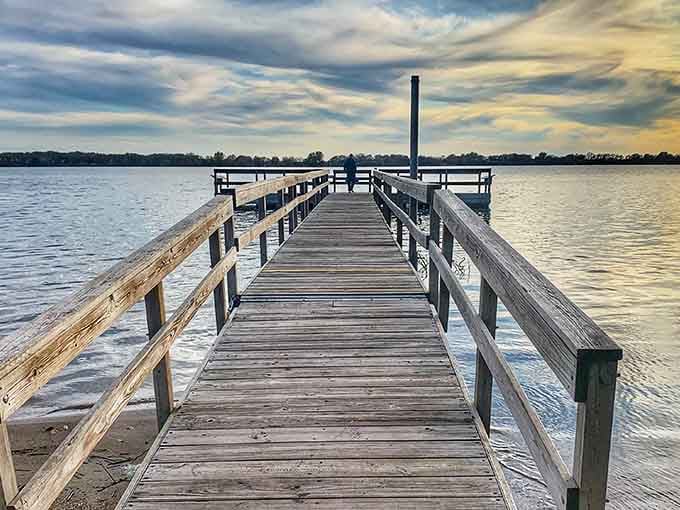 This dock stretches into the kind of peaceful water scene that makes you forget your phone exists for a minute.