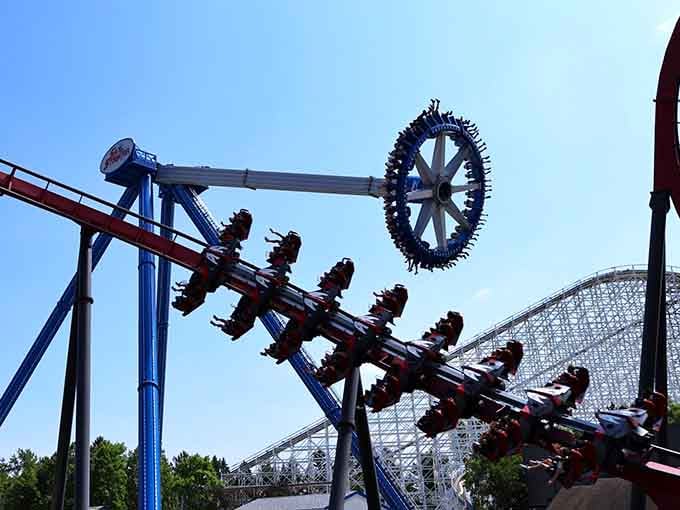 Multiple thrill rides clustered together like they're competing for who can make visitors scream the loudest today.