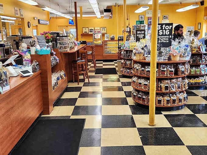 Classic checkerboard floors and wooden displays create a nostalgic ice cream parlor vibe that feels wonderfully timeless.