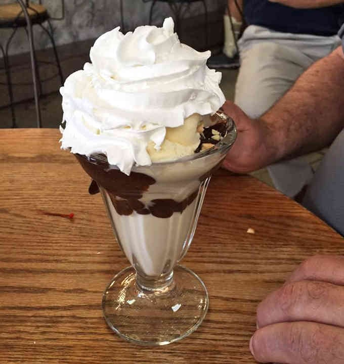 Hot fudge cascading down vanilla ice cream is basically edible therapy in a classic glass dish.