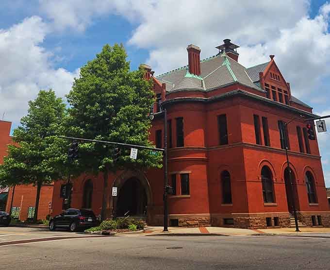 Red brick and dramatic architecture make this civic building look more like a castle than a place for paperwork and permits.